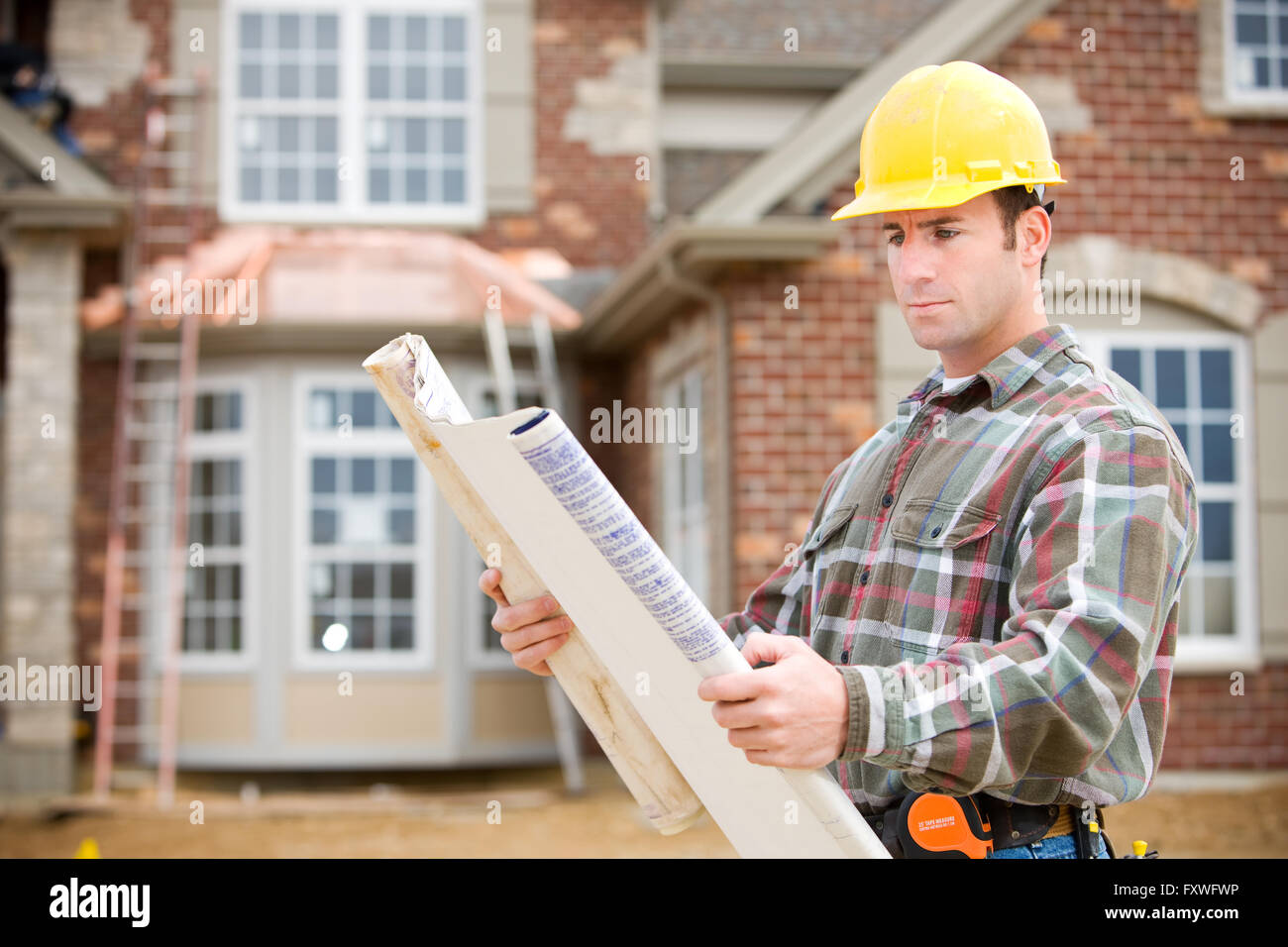Series at a new home construction site. Includes construction worker ...