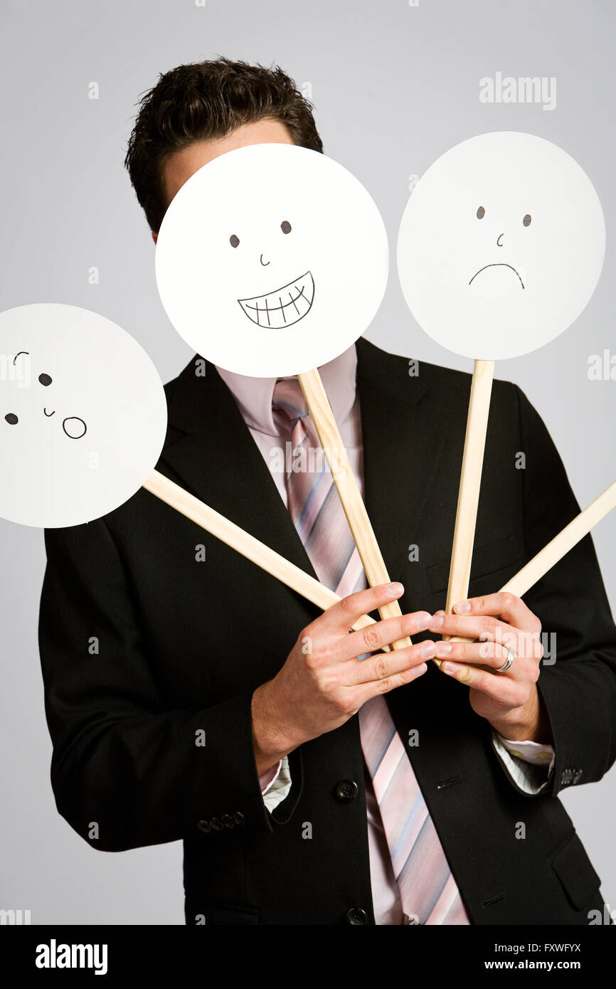 Face peeking behind mask hi-res stock photography and images - Alamy