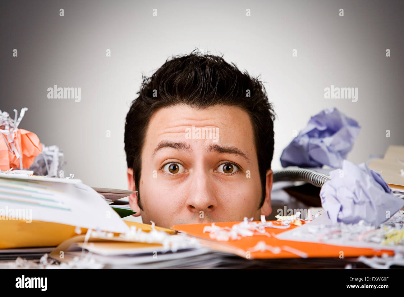 Series with a businessman overwhelmed and buried by work Stock Photo ...