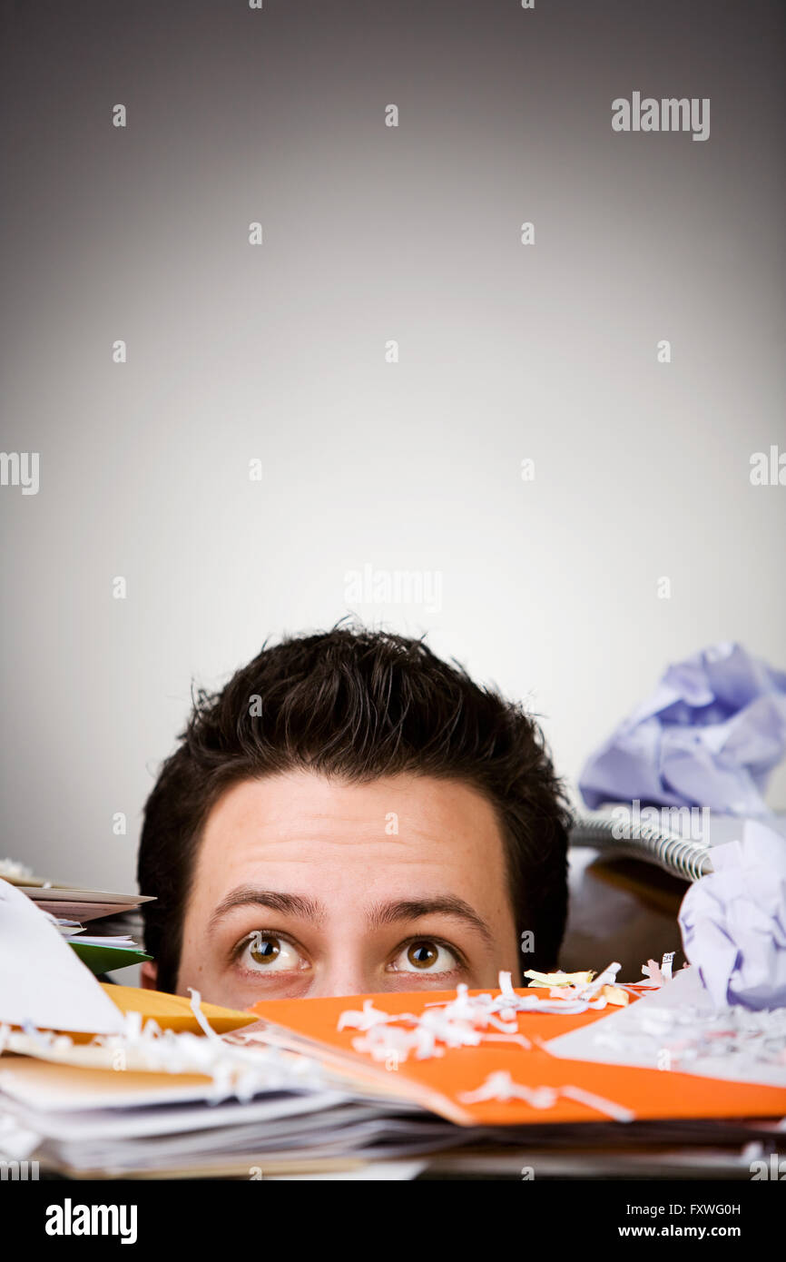 Series with a businessman overwhelmed and buried by work Stock Photo ...