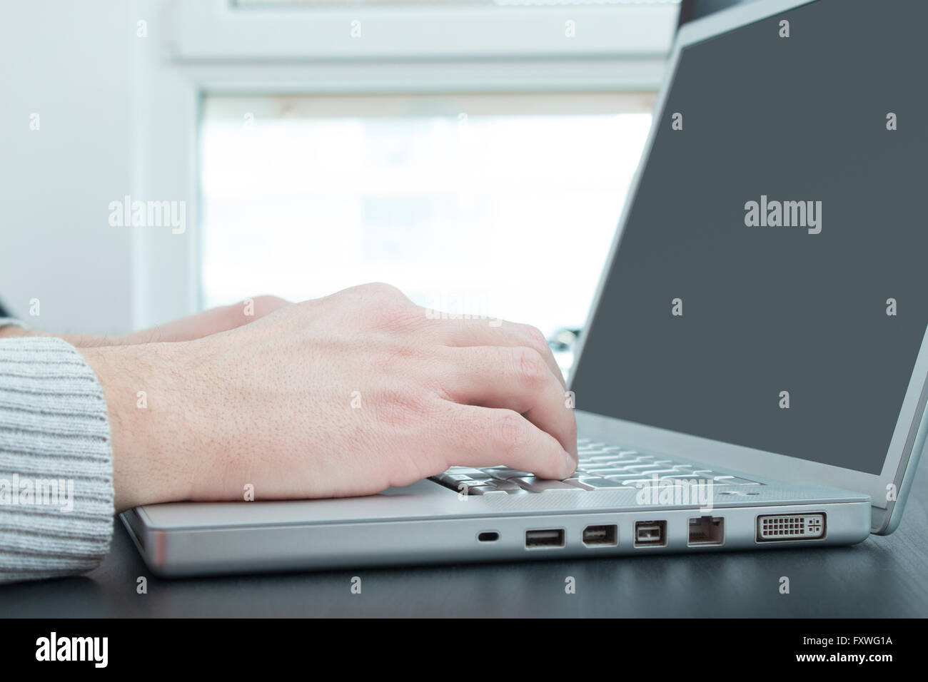 Hands and laptop Stock Photo - Alamy