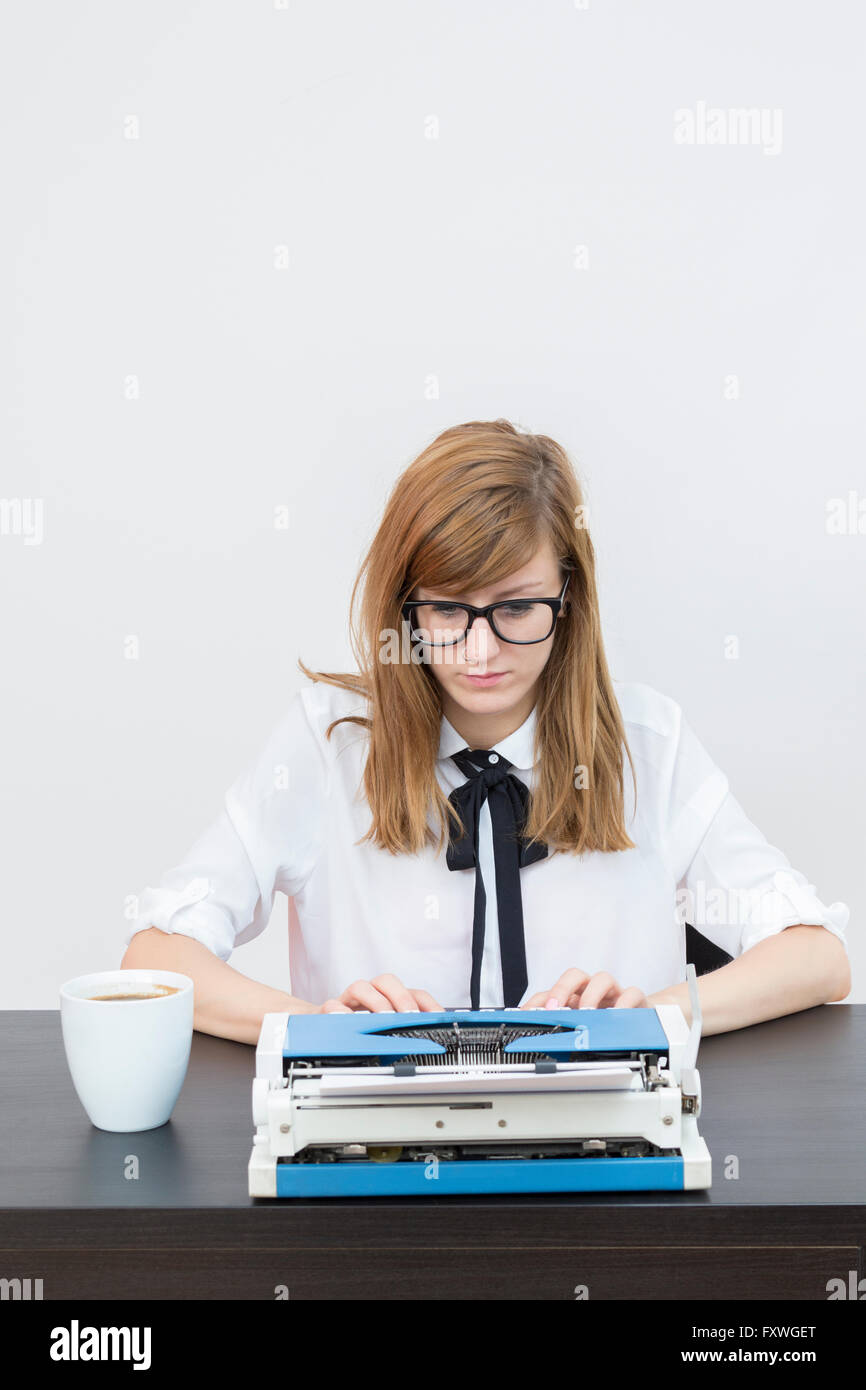 Woman writer at her desk Stock Photo - Alamy