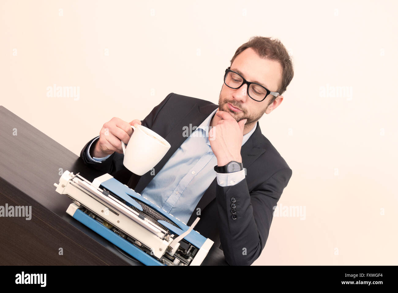 Man typewriter thinking hi-res stock photography and images - Alamy