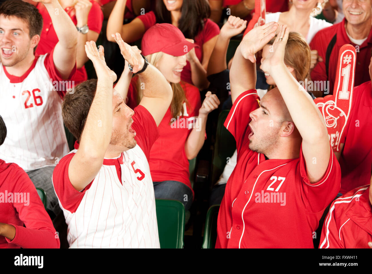 Extensive series of a crowd of baseball fans, sitting in a stadium ...
