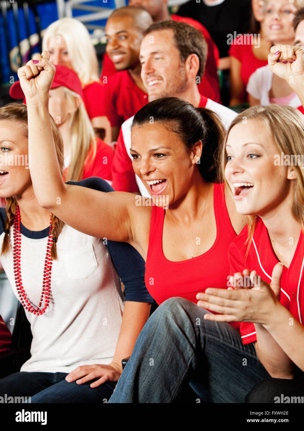 Extensive series of a crowd of baseball fans, sitting in a stadium ...