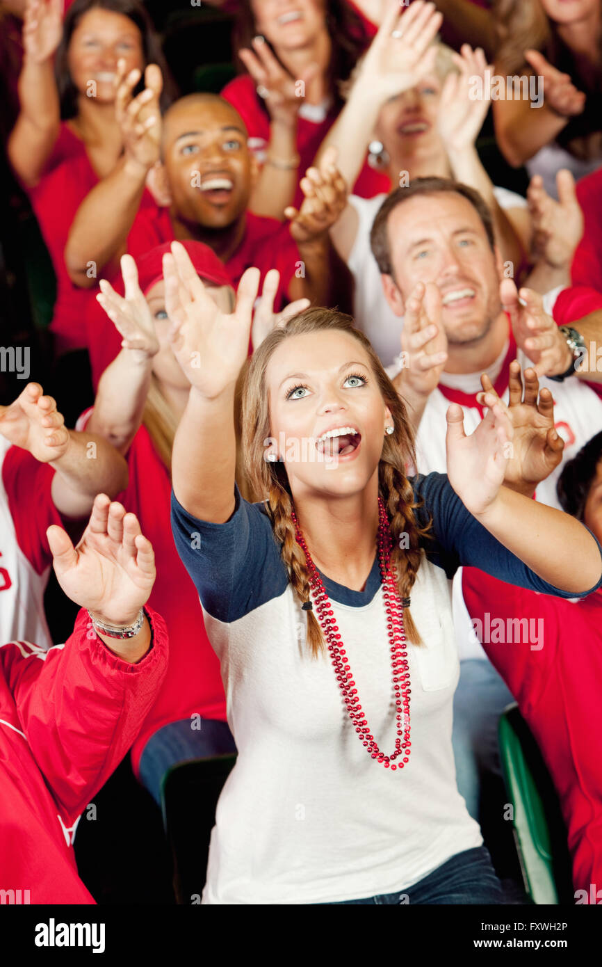 Extensive series of a crowd of baseball fans, sitting in a stadium ...