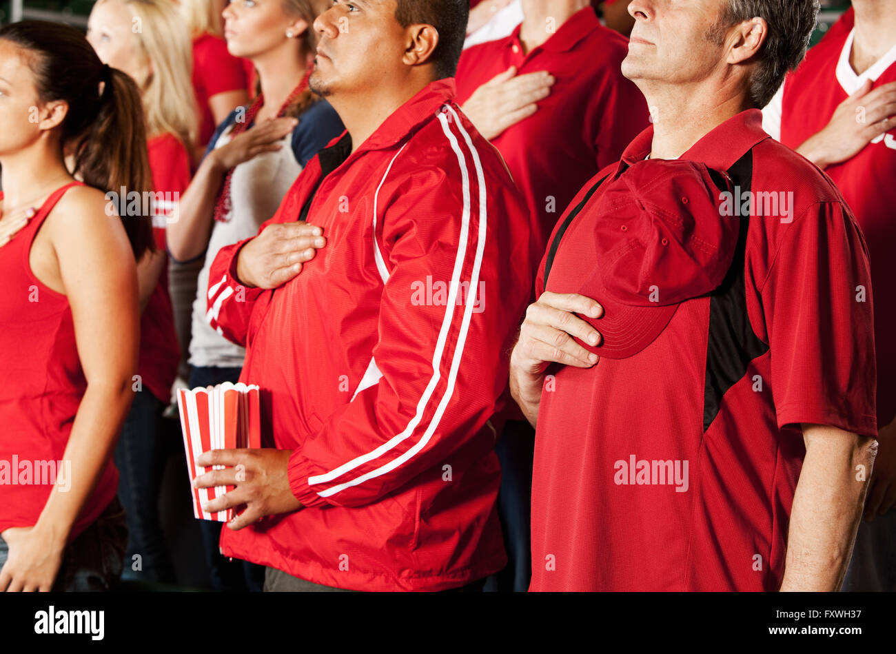 Extensive series of a crowd of baseball fans, sitting in a stadium ...