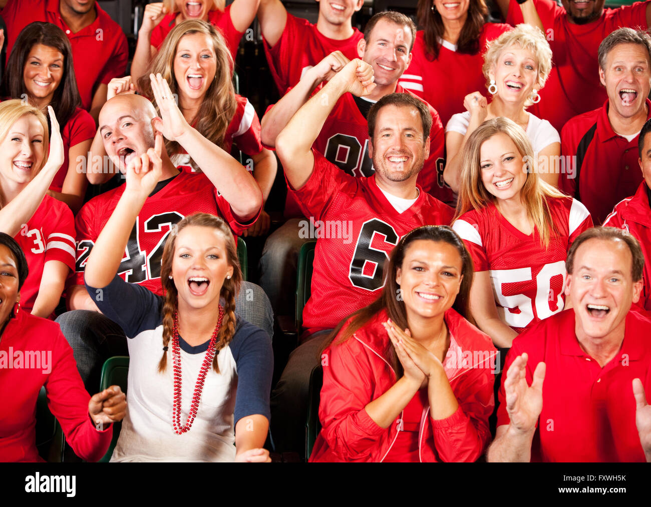 Extensive series of a crowd of fans inside a stadium watching their ...