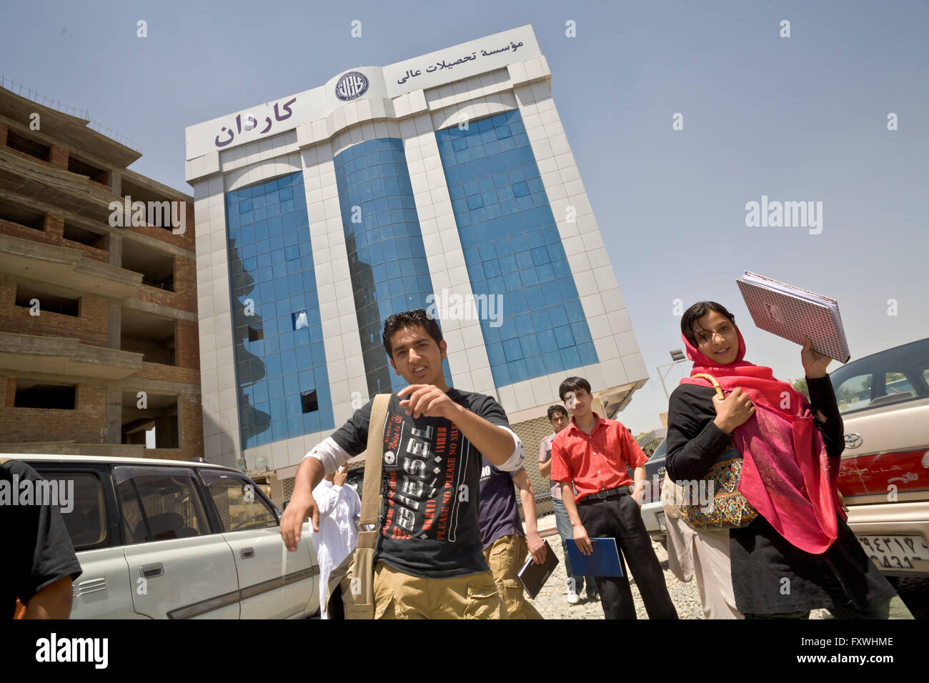 Students in front of the private Kardan University in Kabul ...