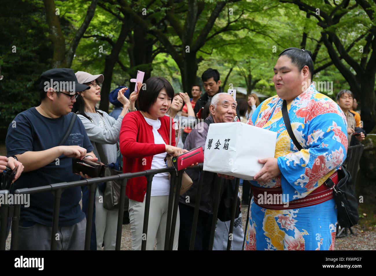 Tokyo Japan. 18th Apr, 2016. A wrestler collects donations for victims ...