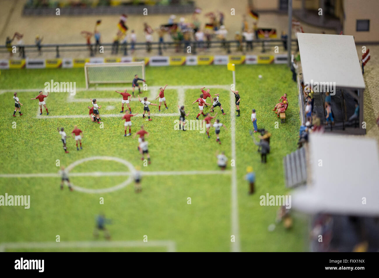Dortmund, Germany. 19th Apr, 2016. A model football field with players ...