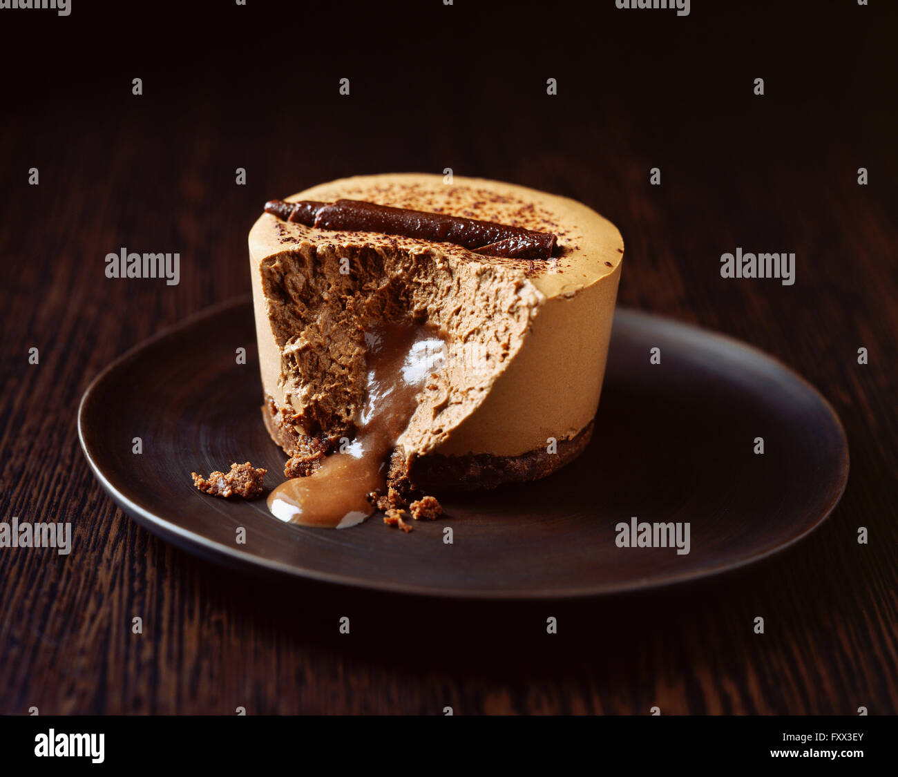 Chocolate mouse on plate oozing chocolate sauce Stock Photo - Alamy