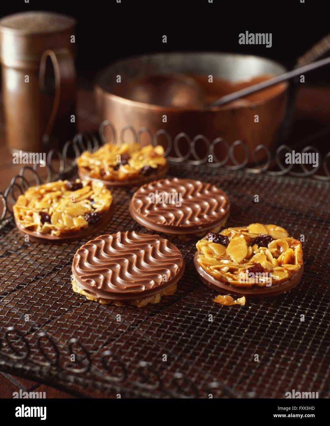 Chocolate coated florentine biscuits on cooling rack Stock Photo - Alamy