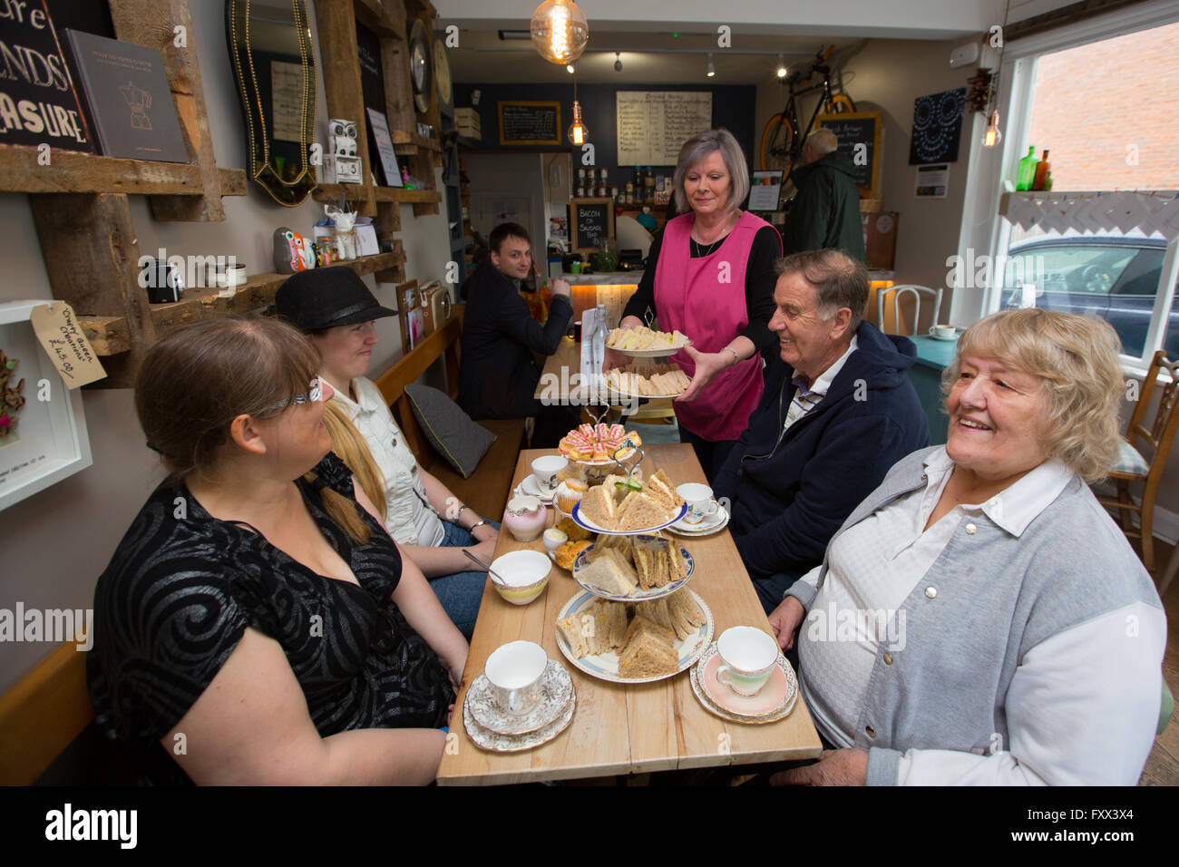 People eating and drinking in a coffee shop Stock Photo - Alamy