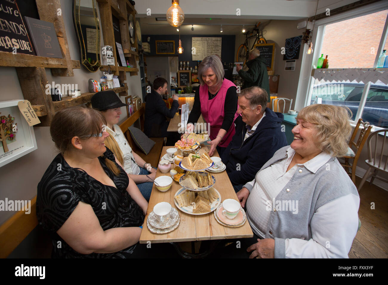 People eating and drinking in a coffee shop Stock Photo - Alamy