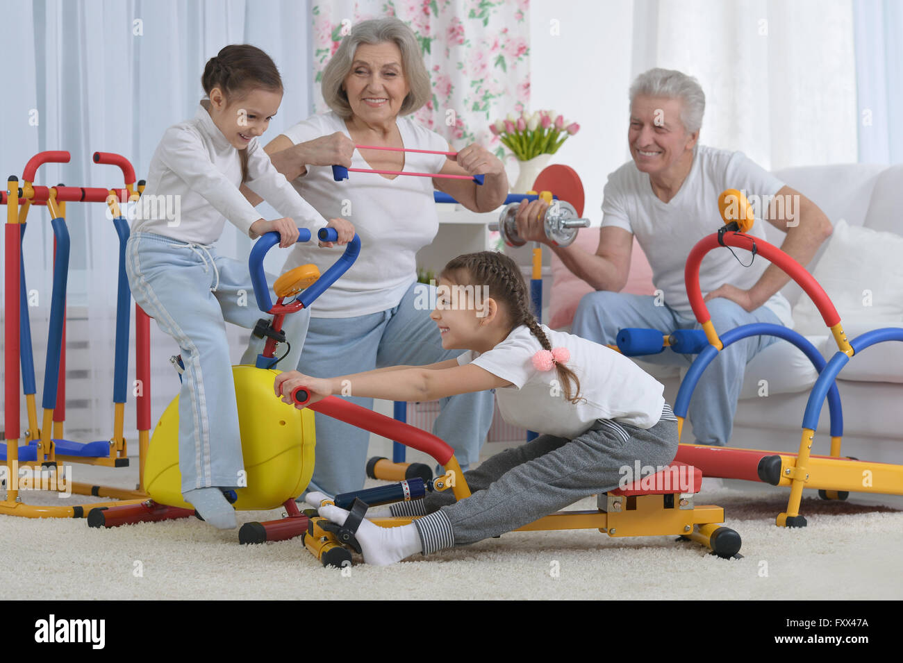 grandparents and granddaughters doing exercise Stock Photo - Alamy