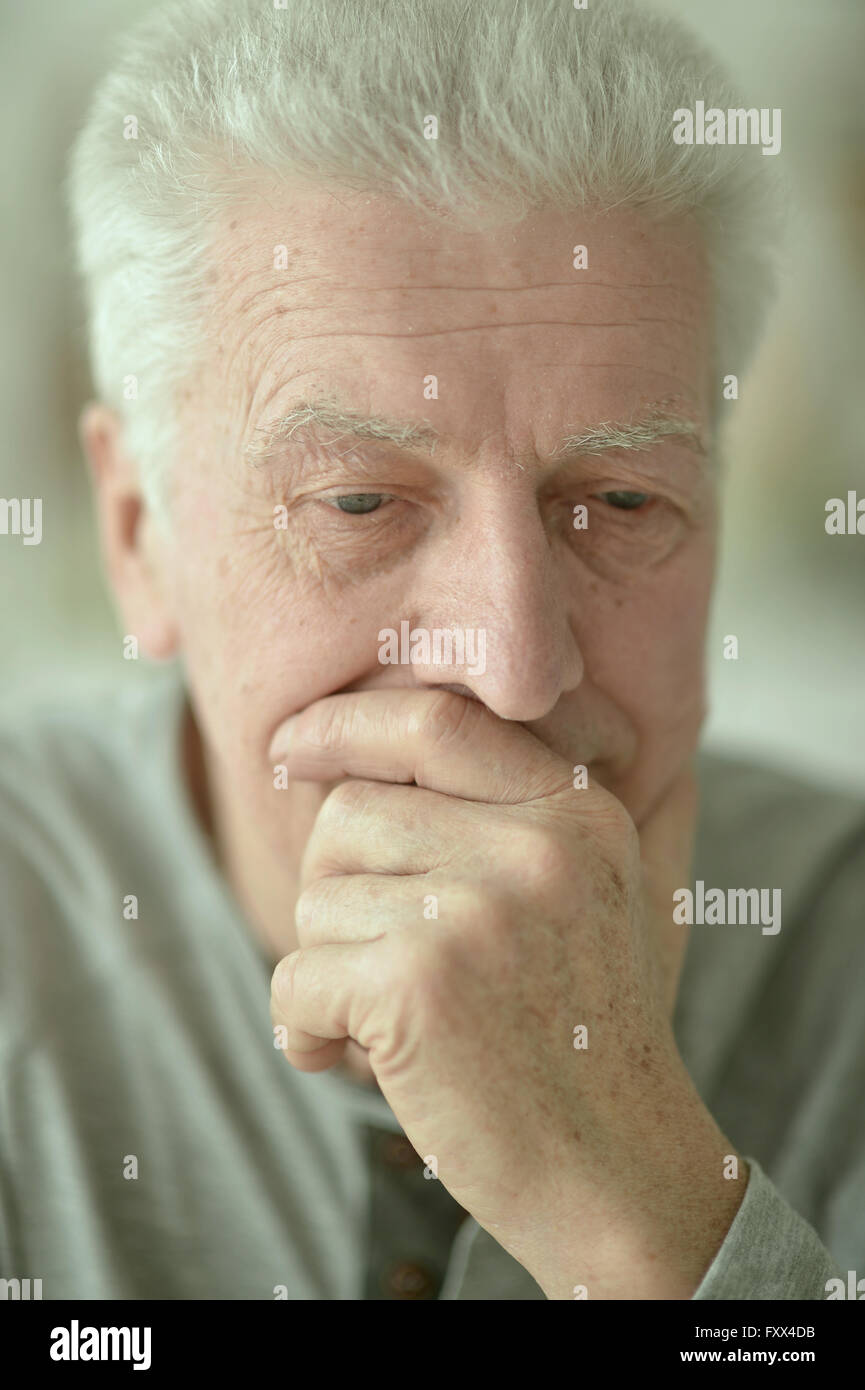 Sad senior man at home Stock Photo - Alamy