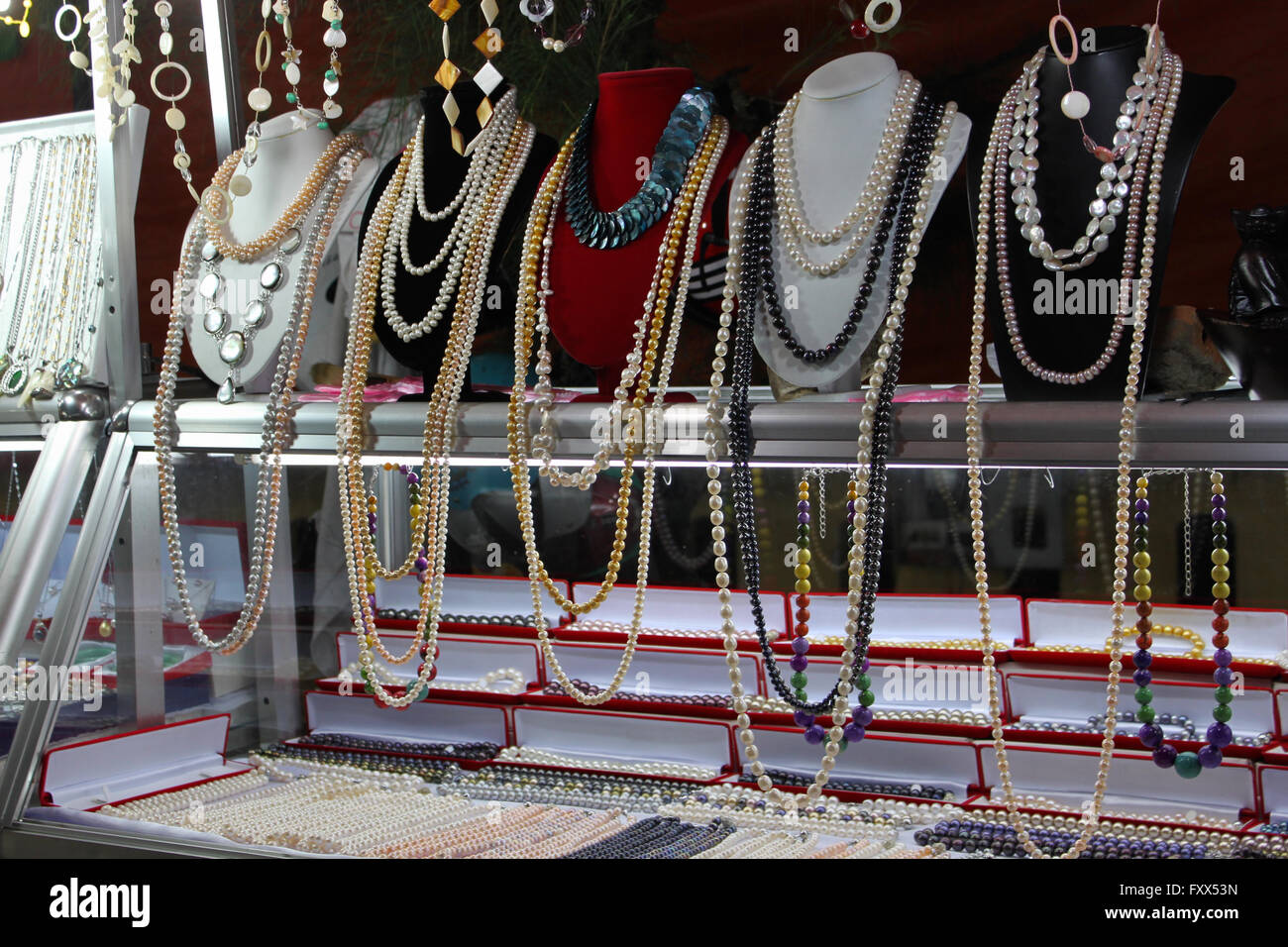 Women's jewelry made of pearls on display Stock Photo - Alamy