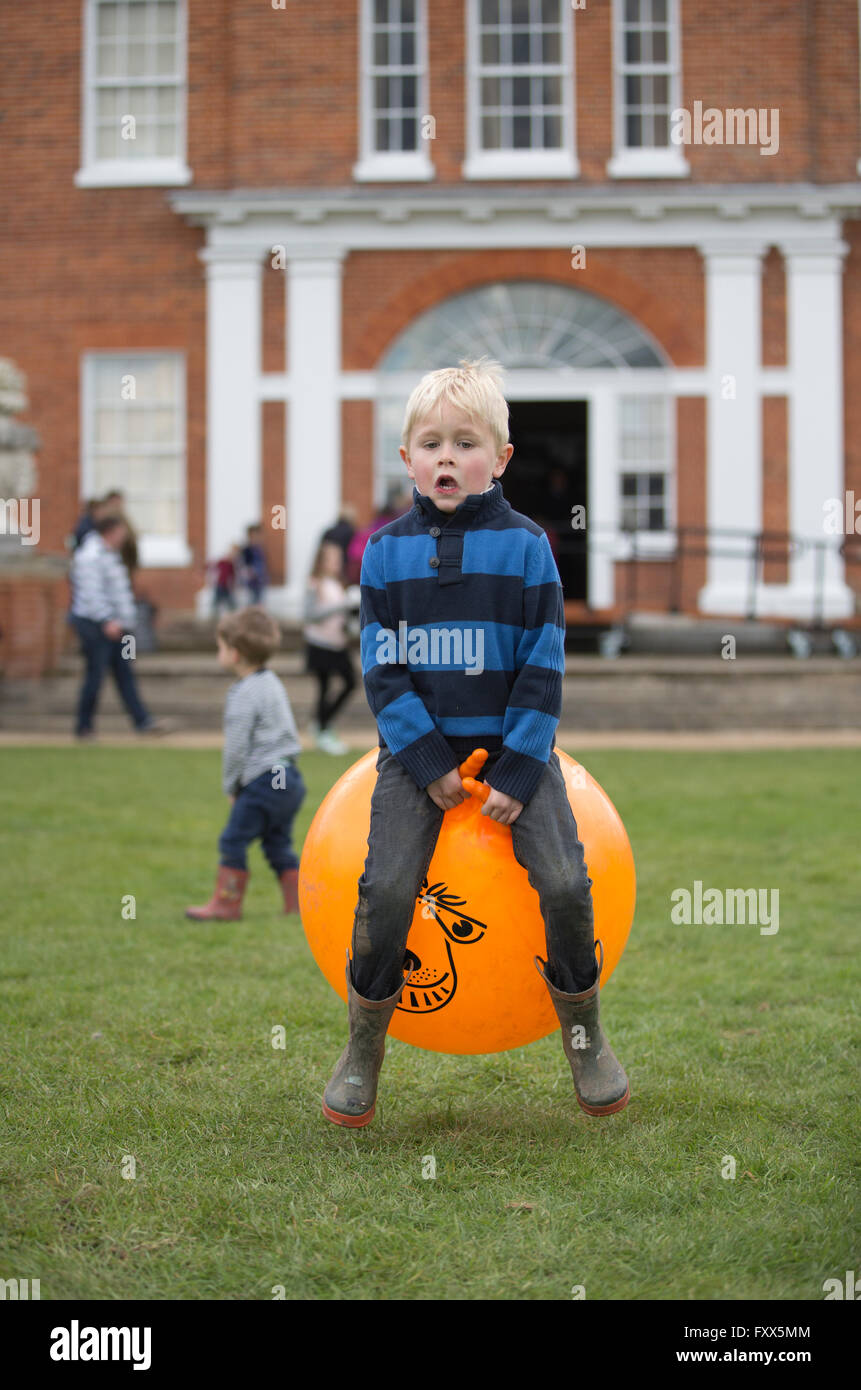 Families having fun on bouncy hoppers outside in the gardens at ...