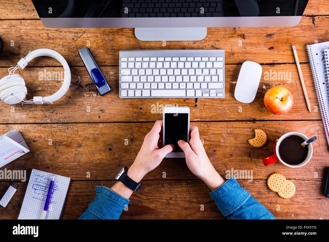 Business person working at office desk wearing smart watch Stock Photo ...