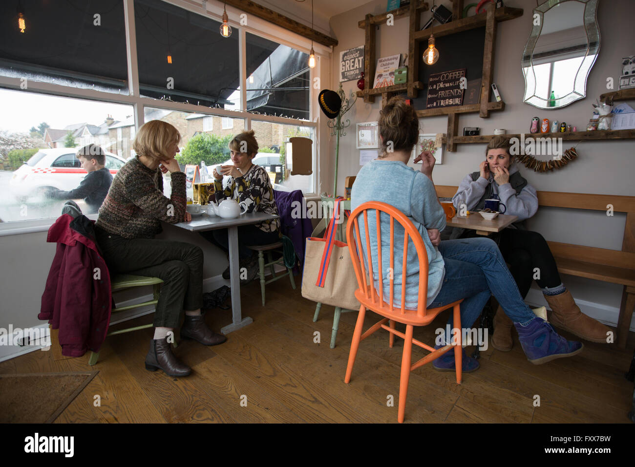 People eating and drinking in a coffee shop Stock Photo - Alamy