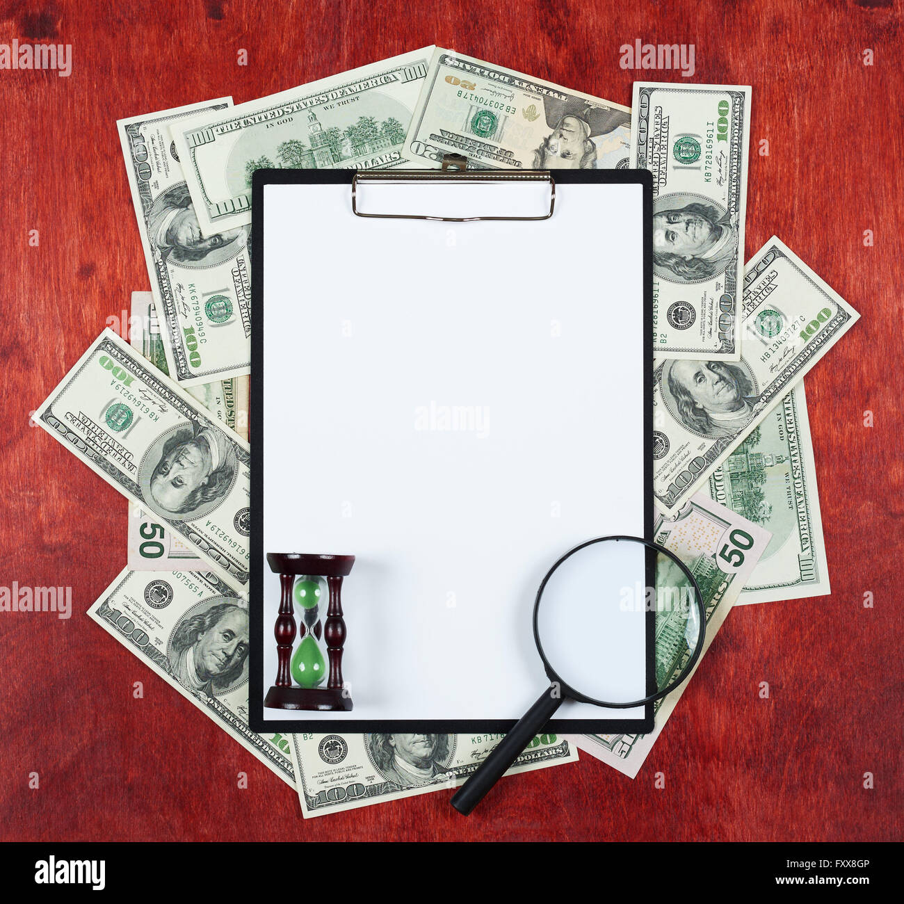 Blank paper sheet in clipboard placed on center of money dollar and ...