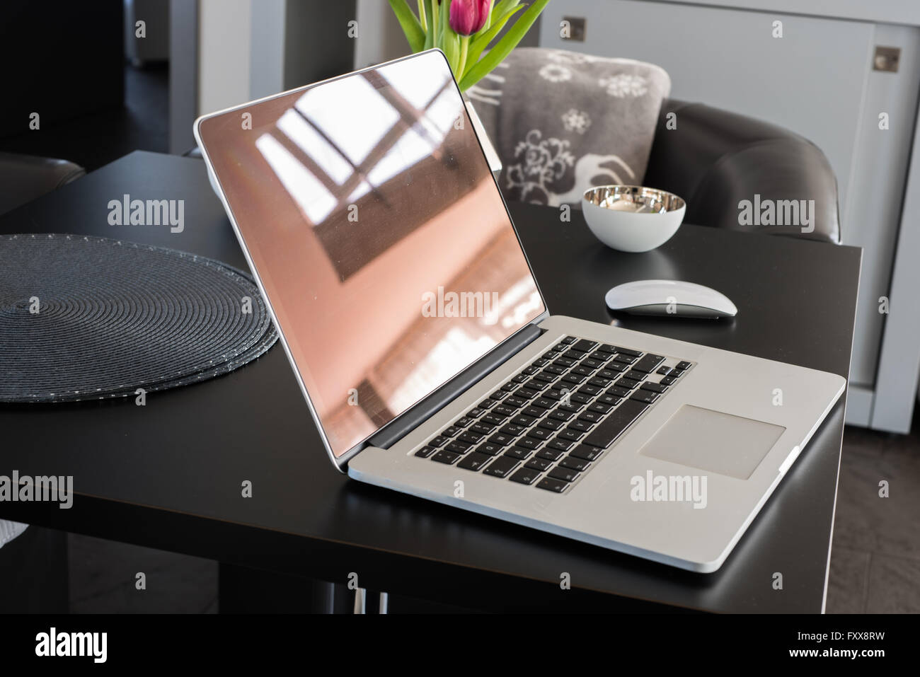 laptop with window reflection standing on table Stock Photo - Alamy