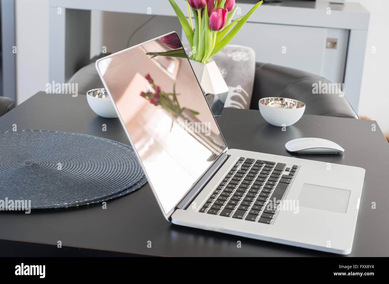 laptop with window reflection standing on table Stock Photo - Alamy