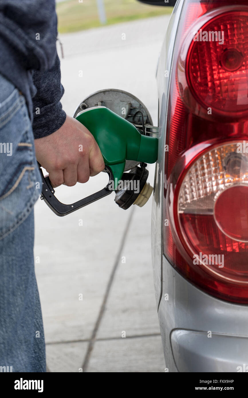 A small car is fueled Stock Photo - Alamy