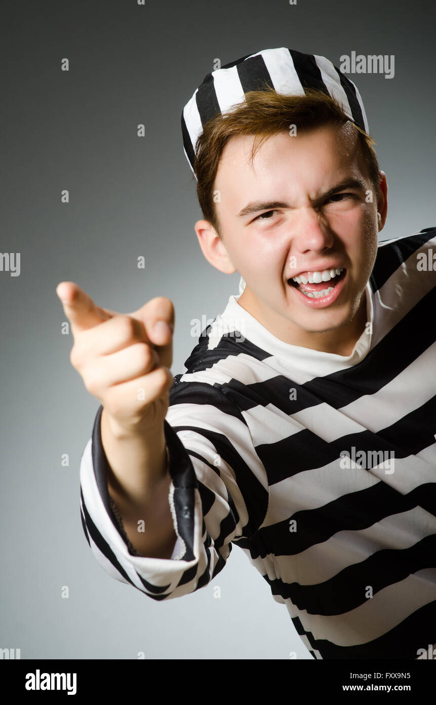 Funny prisoner in prison concept Stock Photo - Alamy