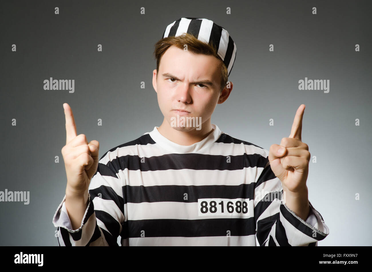 Funny prisoner in prison concept Stock Photo - Alamy