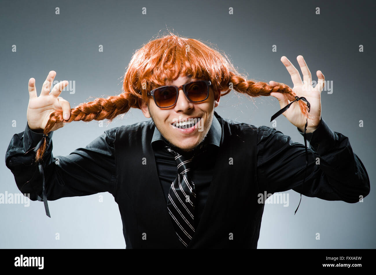 Funny man with red hair wig Stock Photo - Alamy