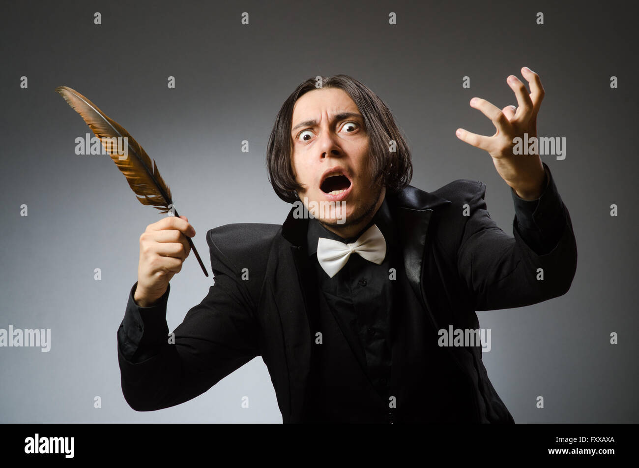 Male author feather writing hi-res stock photography and images - Alamy