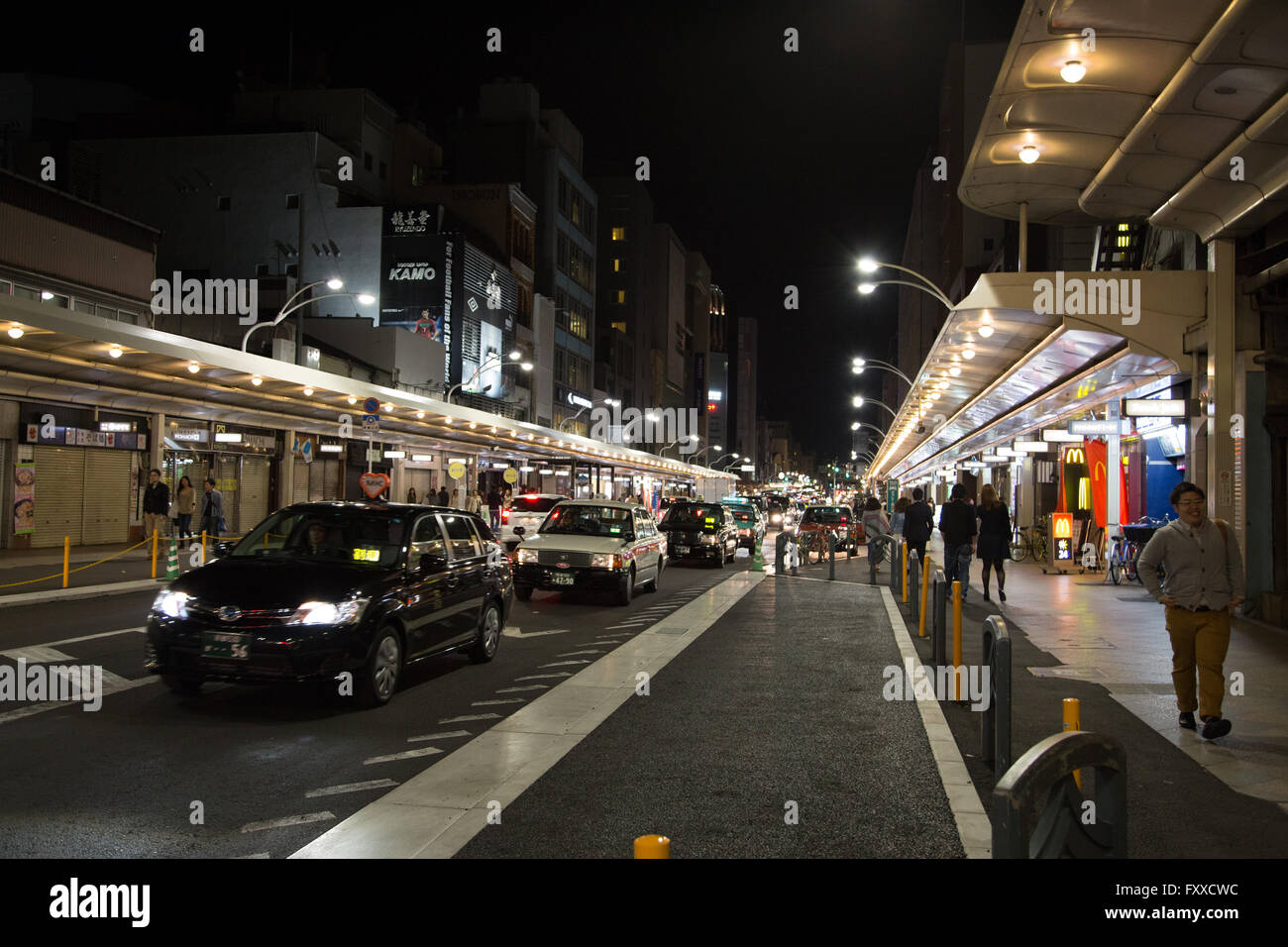 Nighttime traffic on the main street of Shijo Dori in Kyoto, Japan ...