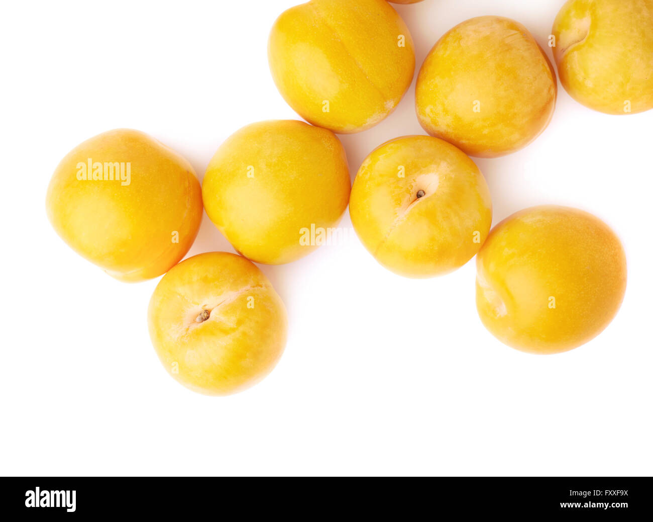Pile of multiple yellow plums isolated Stock Photo - Alamy