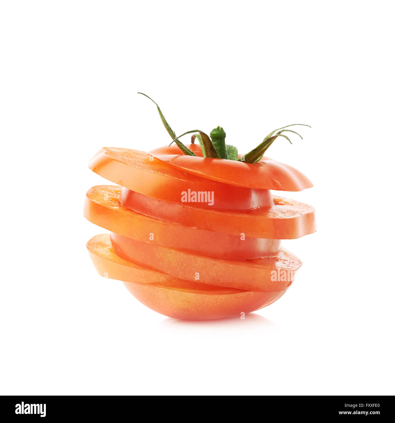 Tomato cut in slices isolated Stock Photo - Alamy