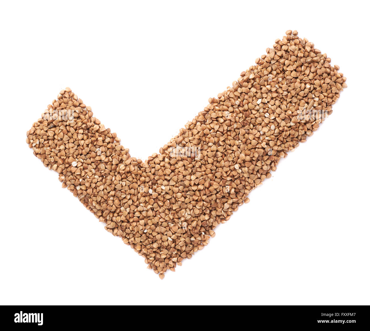 Tick shape made of buckwheat seeds Stock Photo - Alamy