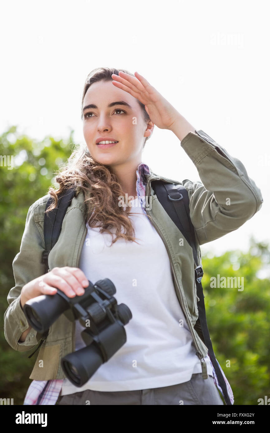 Woman using binoculars Stock Photo - Alamy