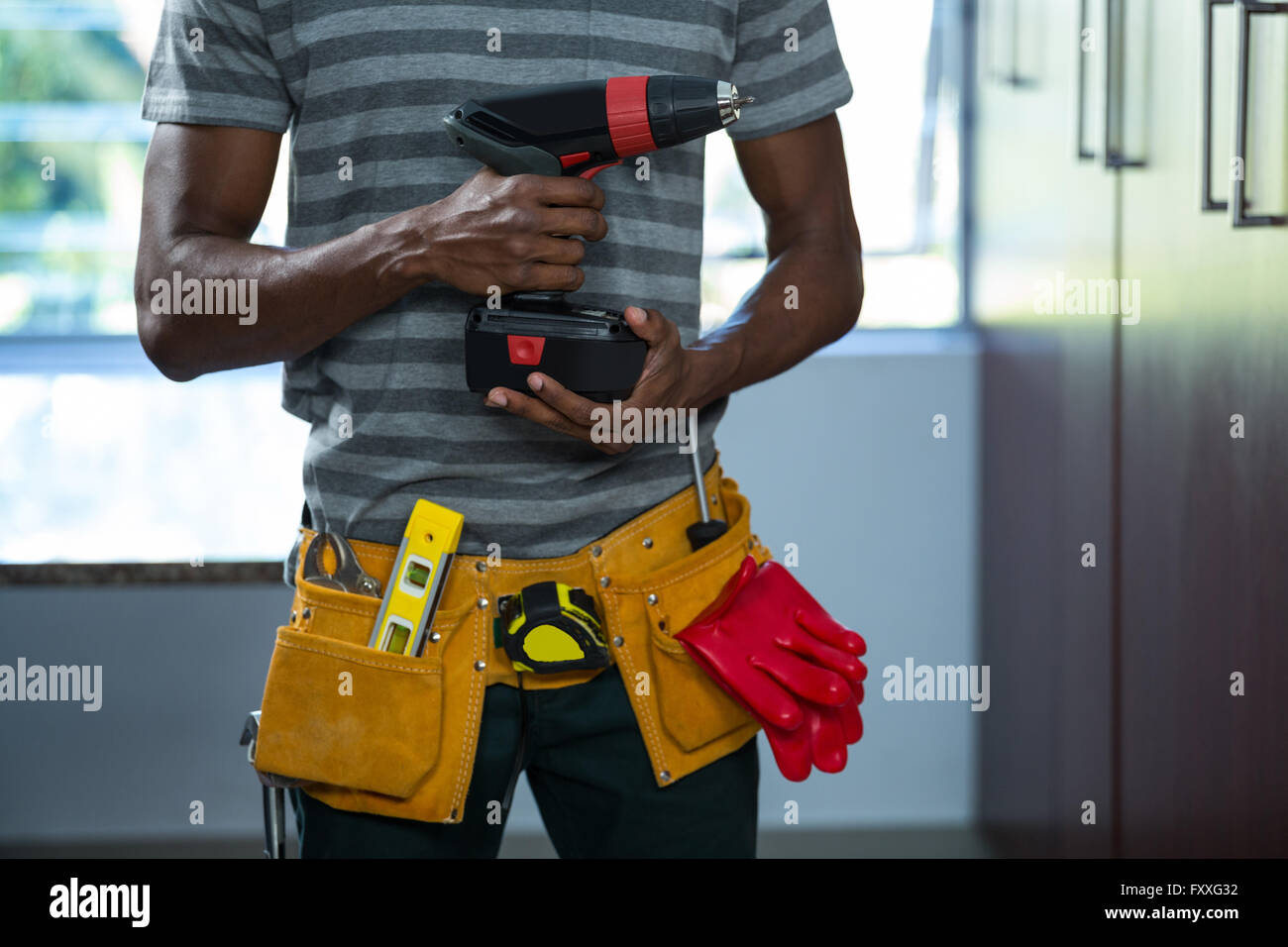 Holding a drill hi-res stock photography and images - Alamy
