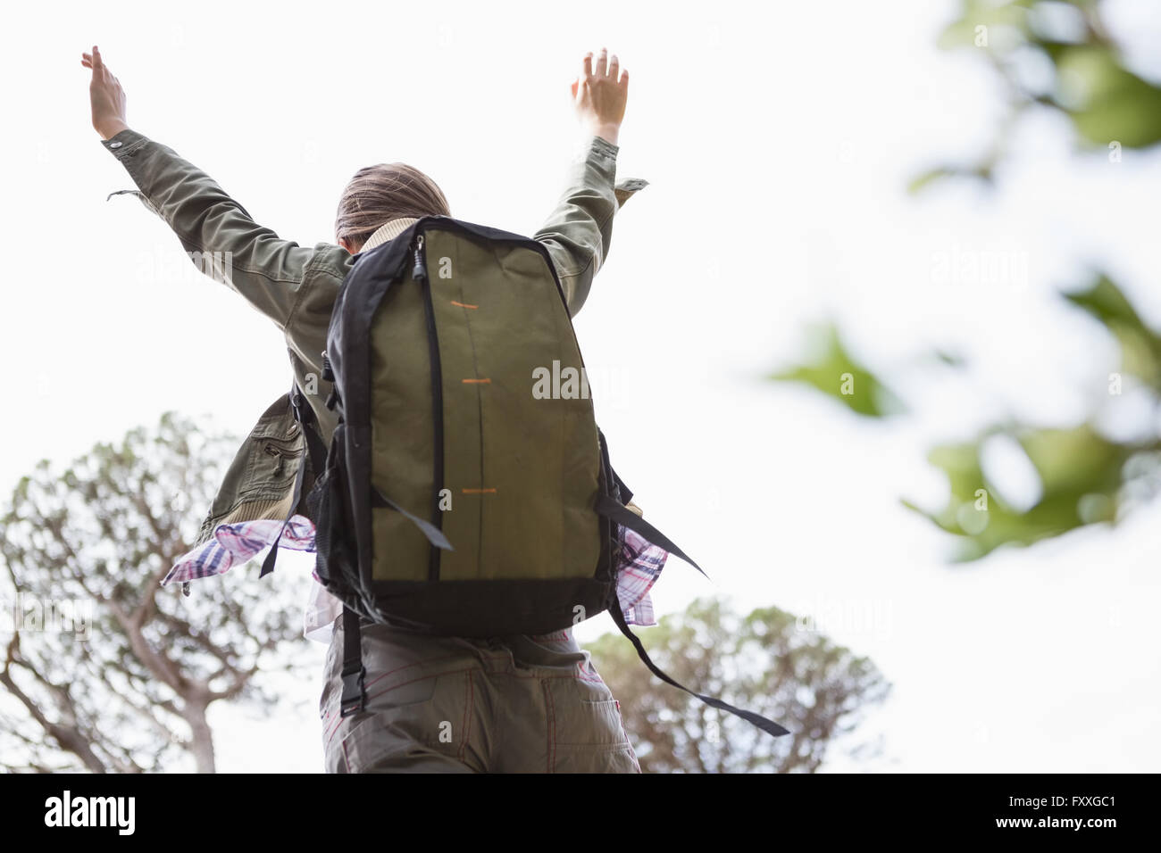 Woman with arms up Stock Photo - Alamy