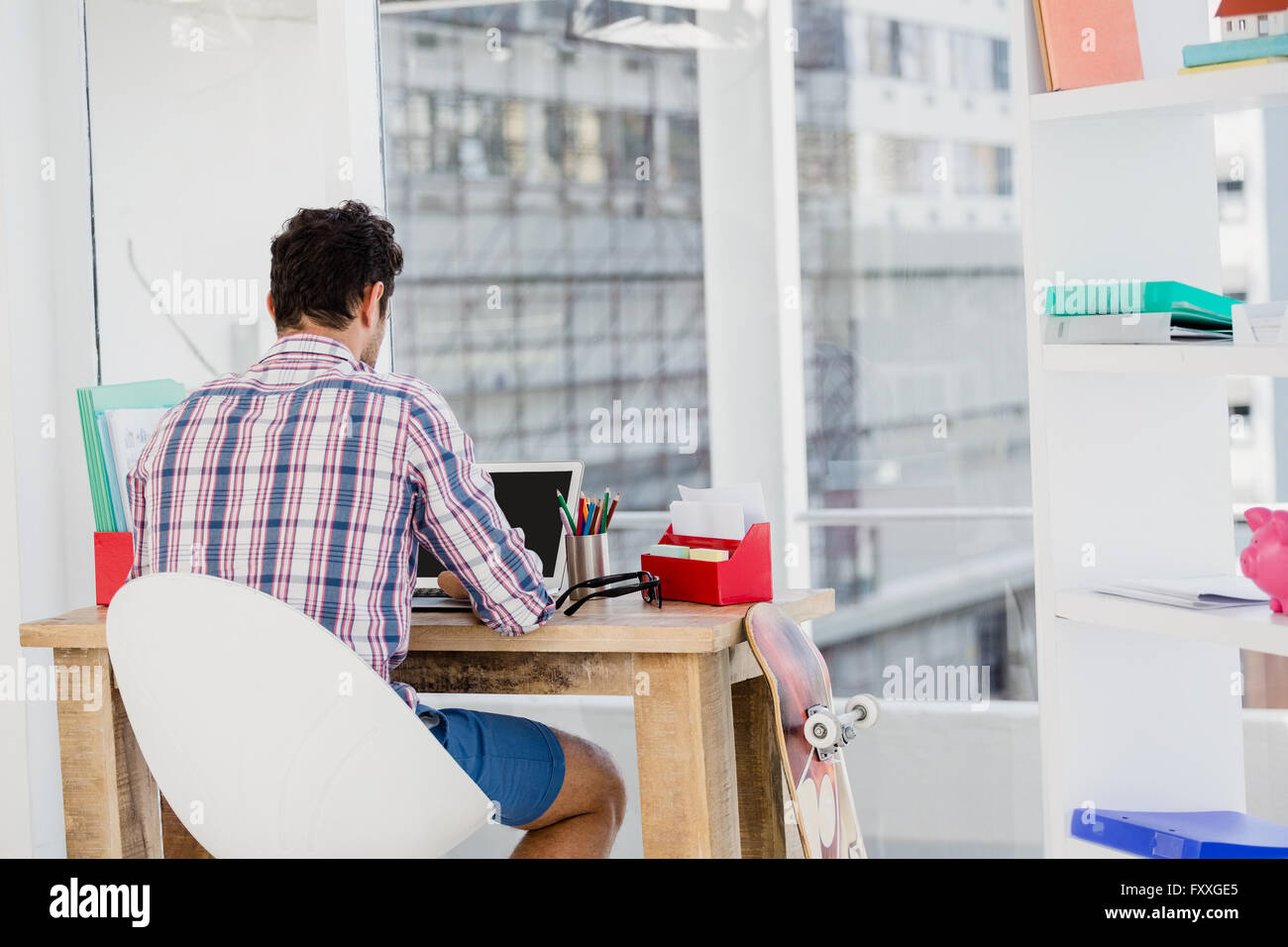 Man sitting desk pencil paper hi-res stock photography and images - Alamy