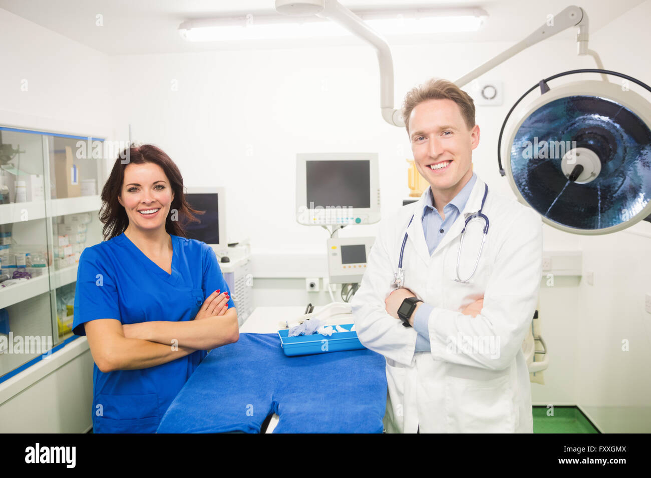 Portrait of happy vets standing with arms crossed Stock Photo - Alamy