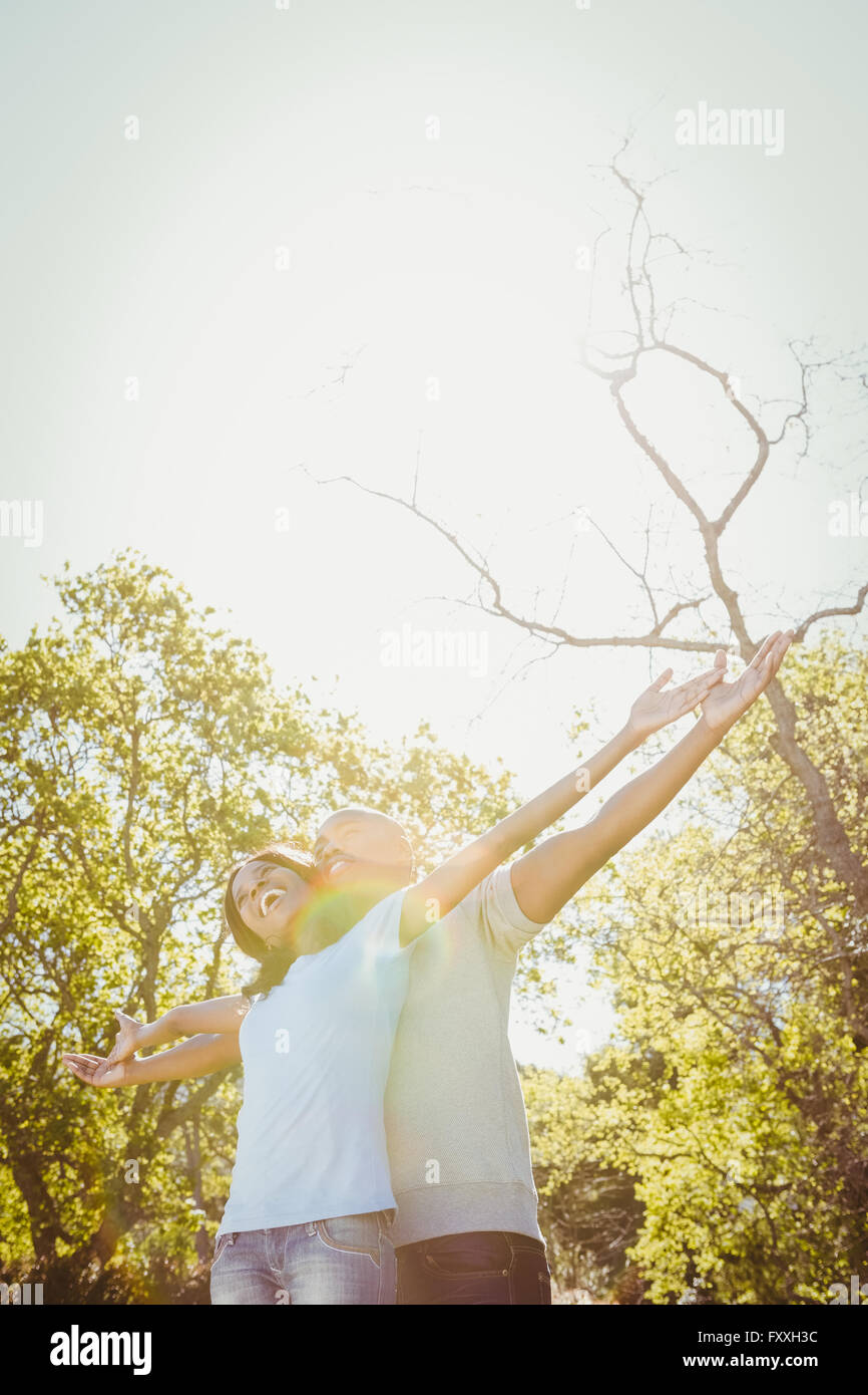 Young couple arms outstretched and having fun Stock Photo - Alamy
