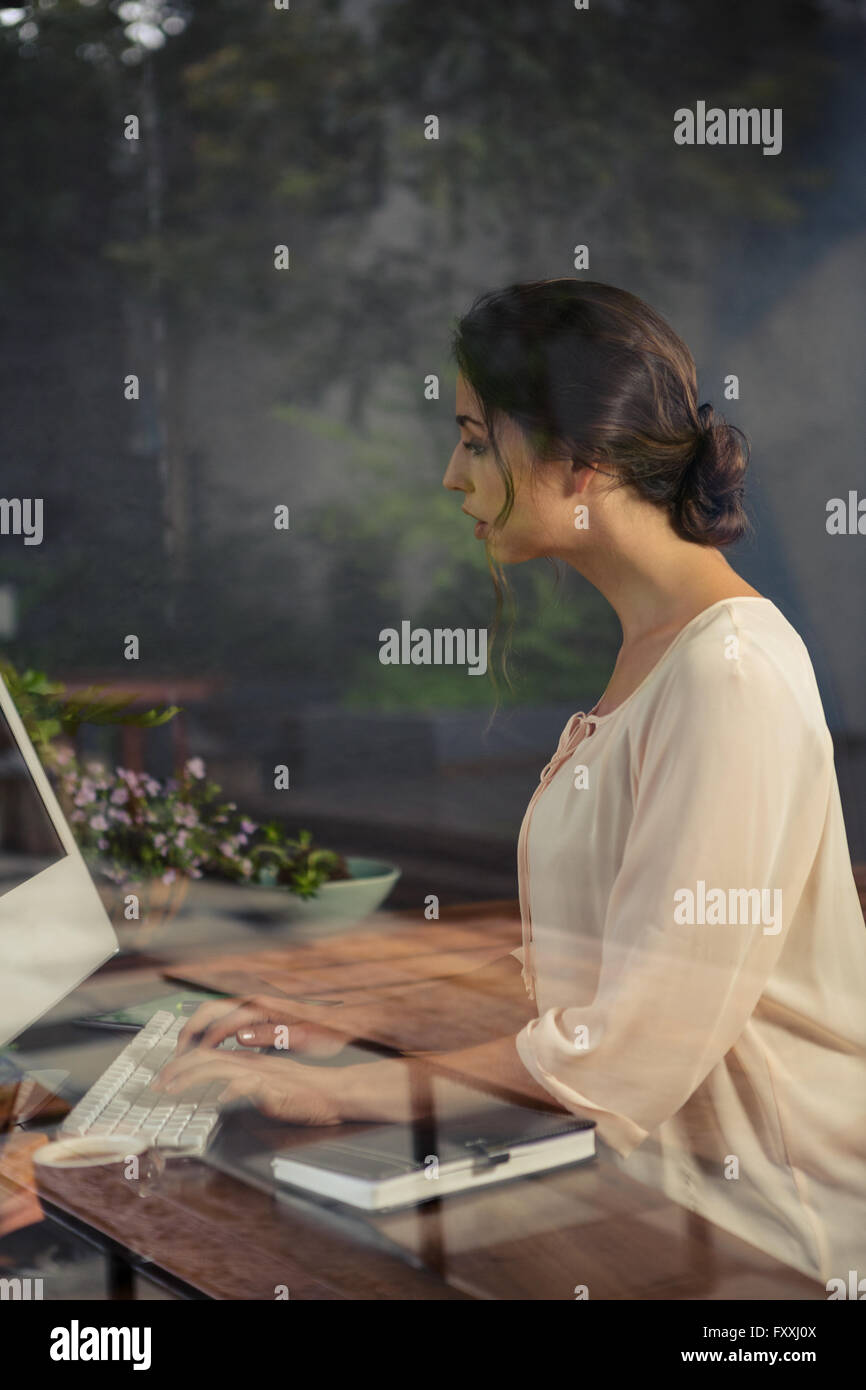 Businesswoman using her computer Stock Photo - Alamy