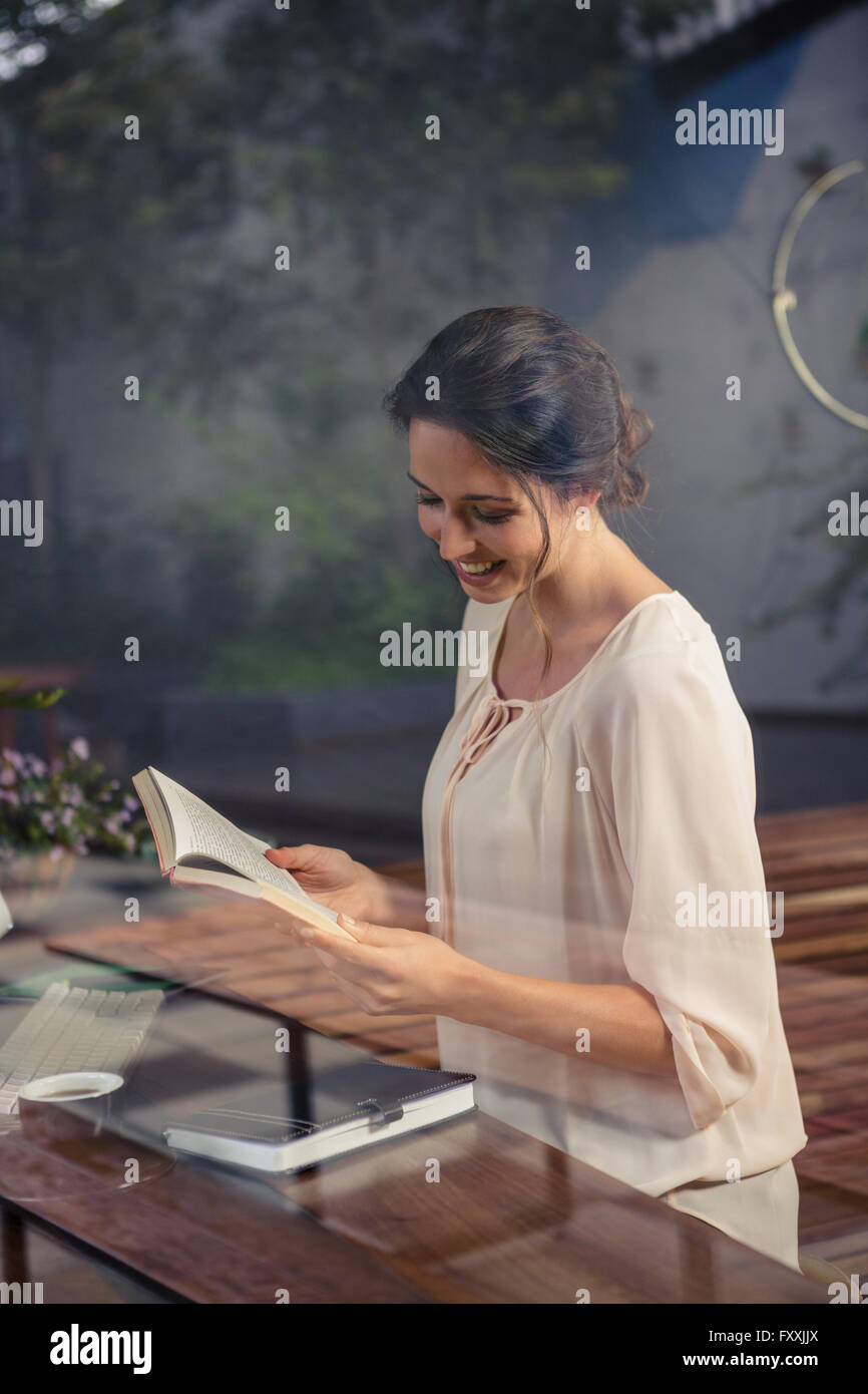 Woman reading files desk hi-res stock photography and images - Alamy