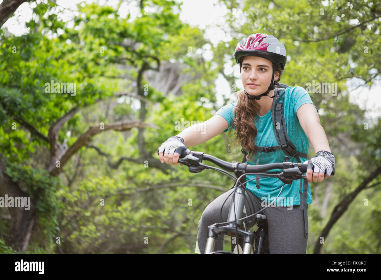 Woman riding her bike Stock Photo - Alamy