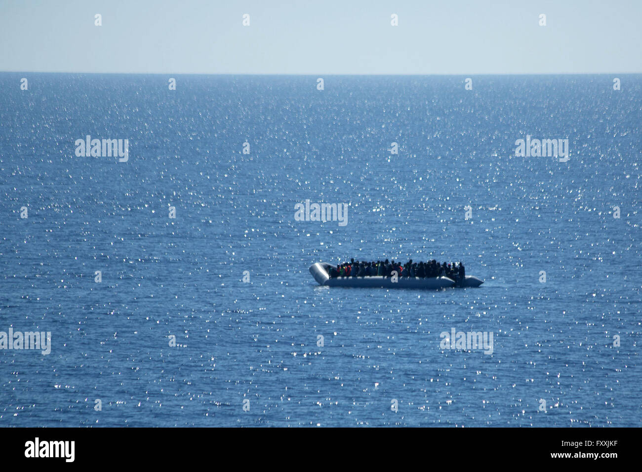 HANDOUT - A rubber boat with shipwrecked refugees drifts on the open ...