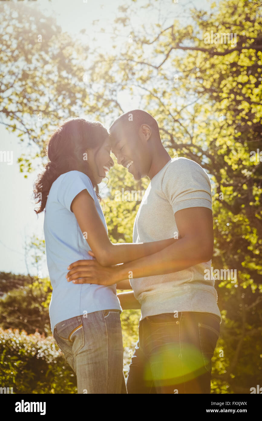 Couple standing face to face in the park Stock Photo - Alamy