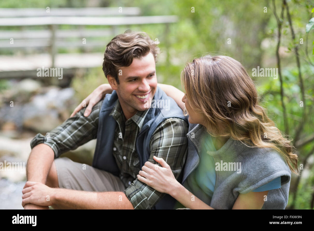 Loving young hikers looking at each other Stock Photo - Alamy