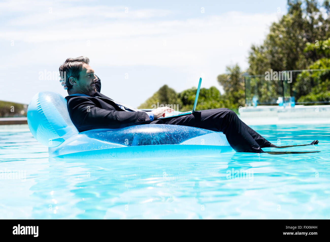 Business man swimming pool inflatable hi-res stock photography and ...